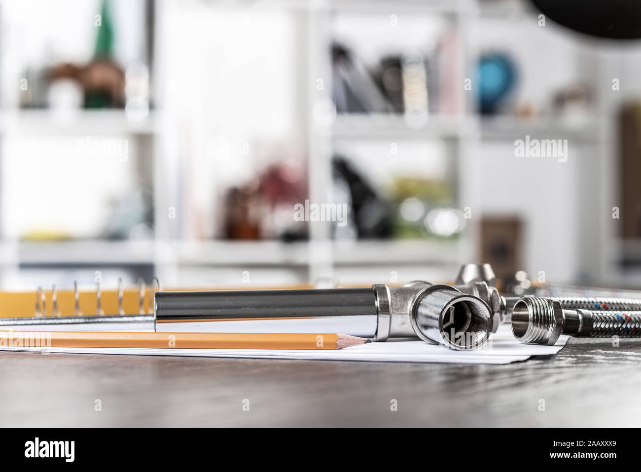 Flexible steel water hoses laying on table Stock Photo - Alamy
