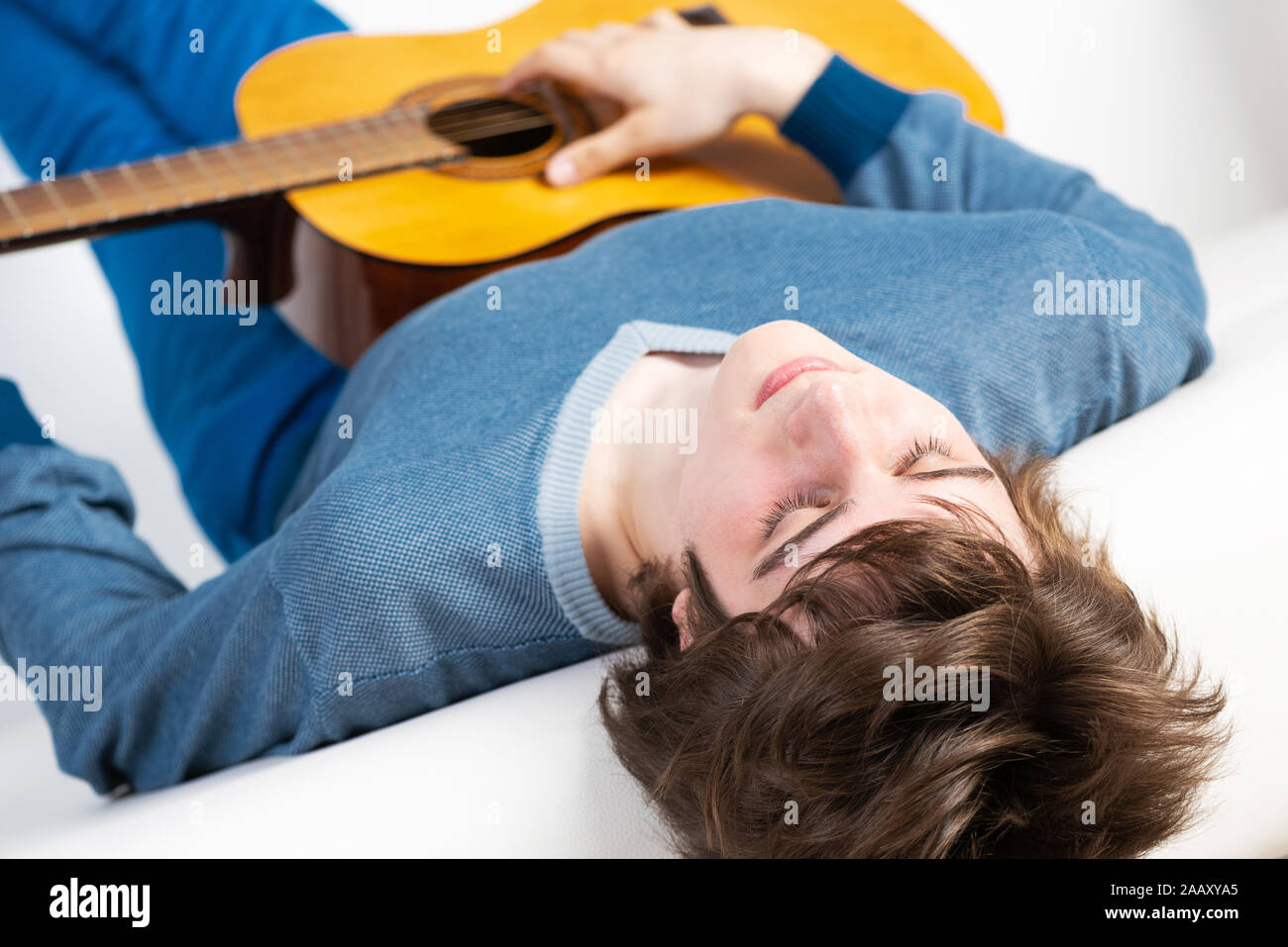 Playing guitar as hobby concept Stock Photo - Alamy