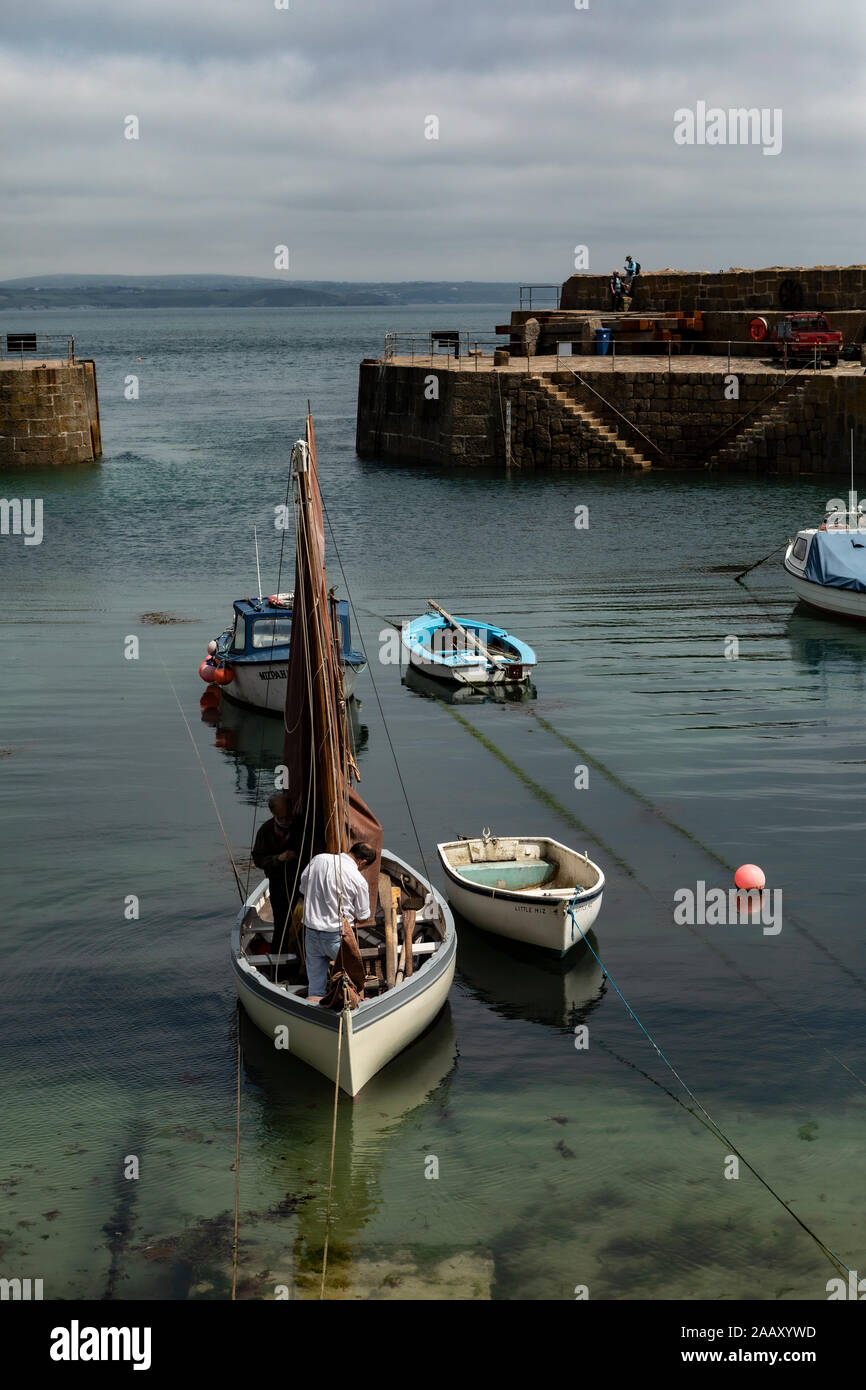 Boats in Mousehole harbour, Cornwall, UK Stock Photo - Alamy