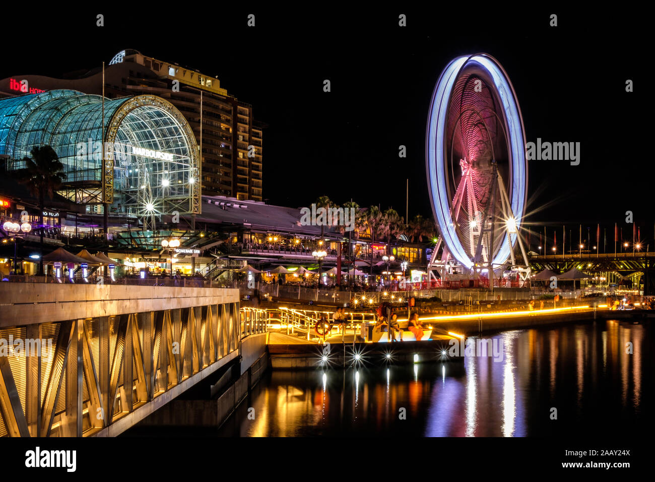 Extravagant lights of Sydney Darling Harbour and its Ferris Wheel Stock ...