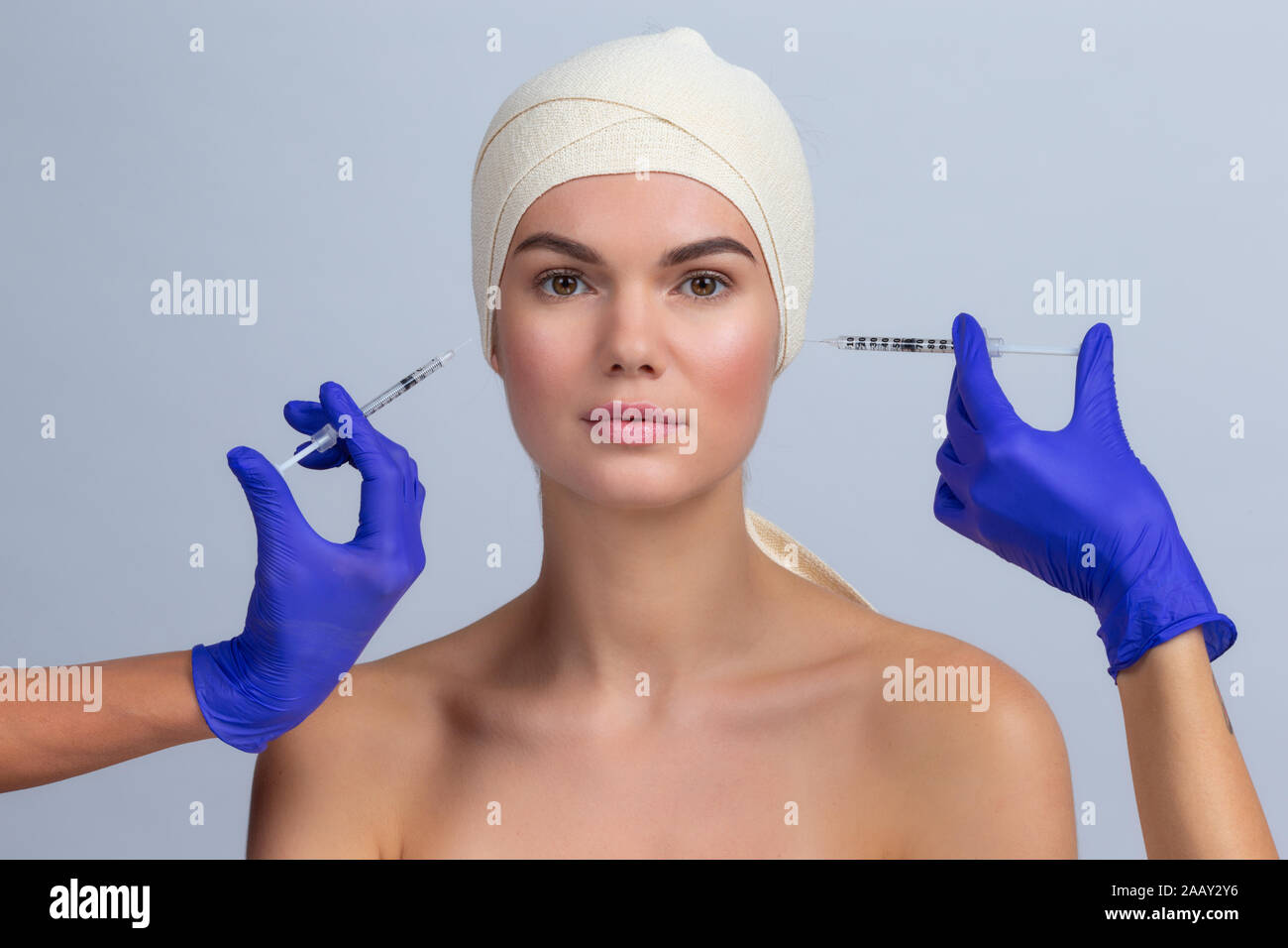 Beautiful woman gets injection in her face beauty treatment concept ...