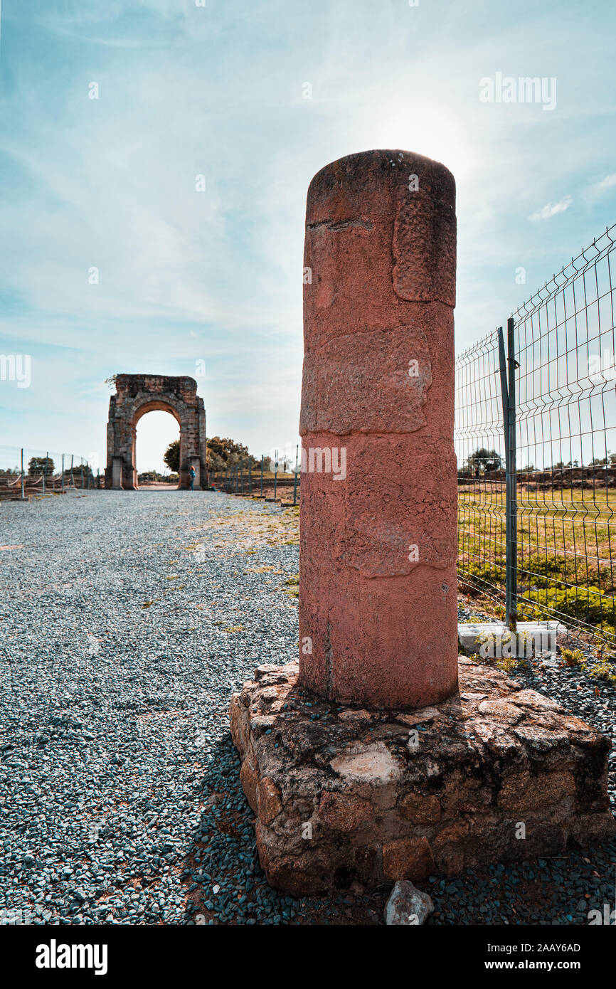Column and Arch of Caparra, ancient roman city of Caparra in ...