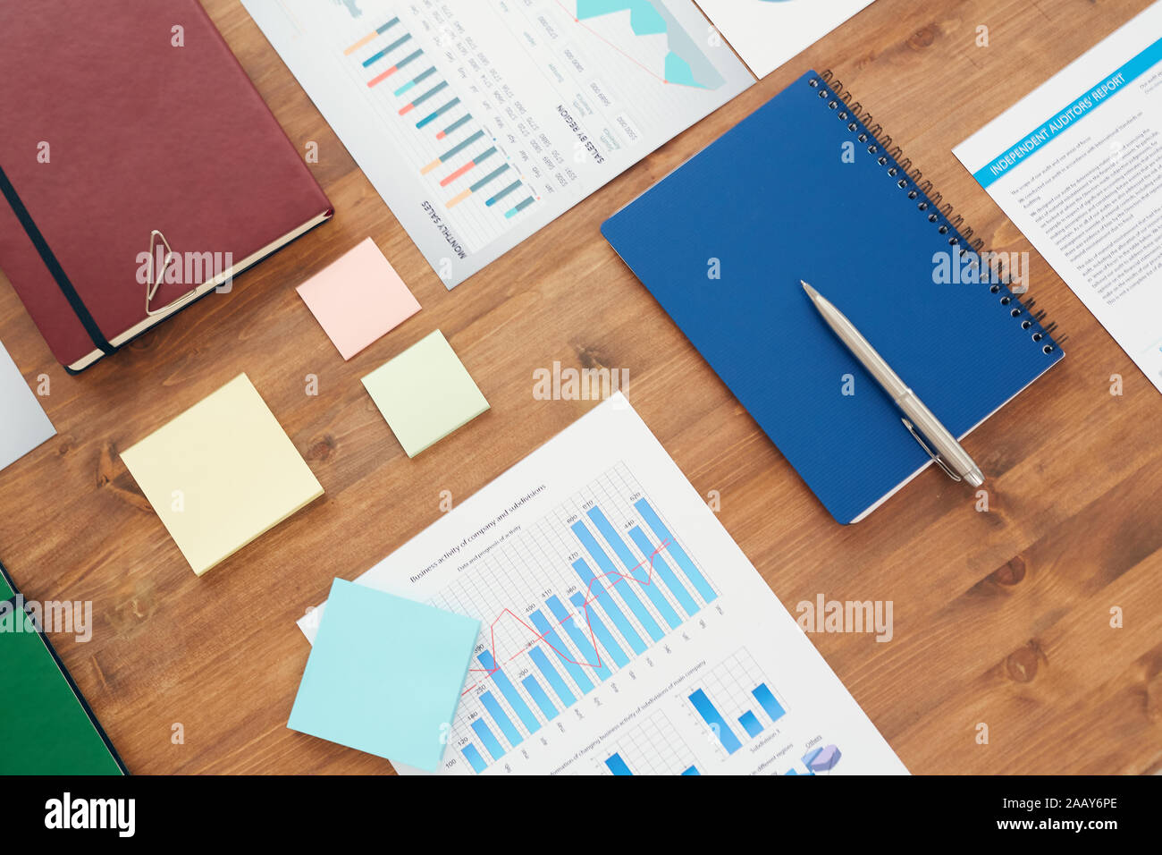 Graphic flat lay background of office workplace with statistic charts ...