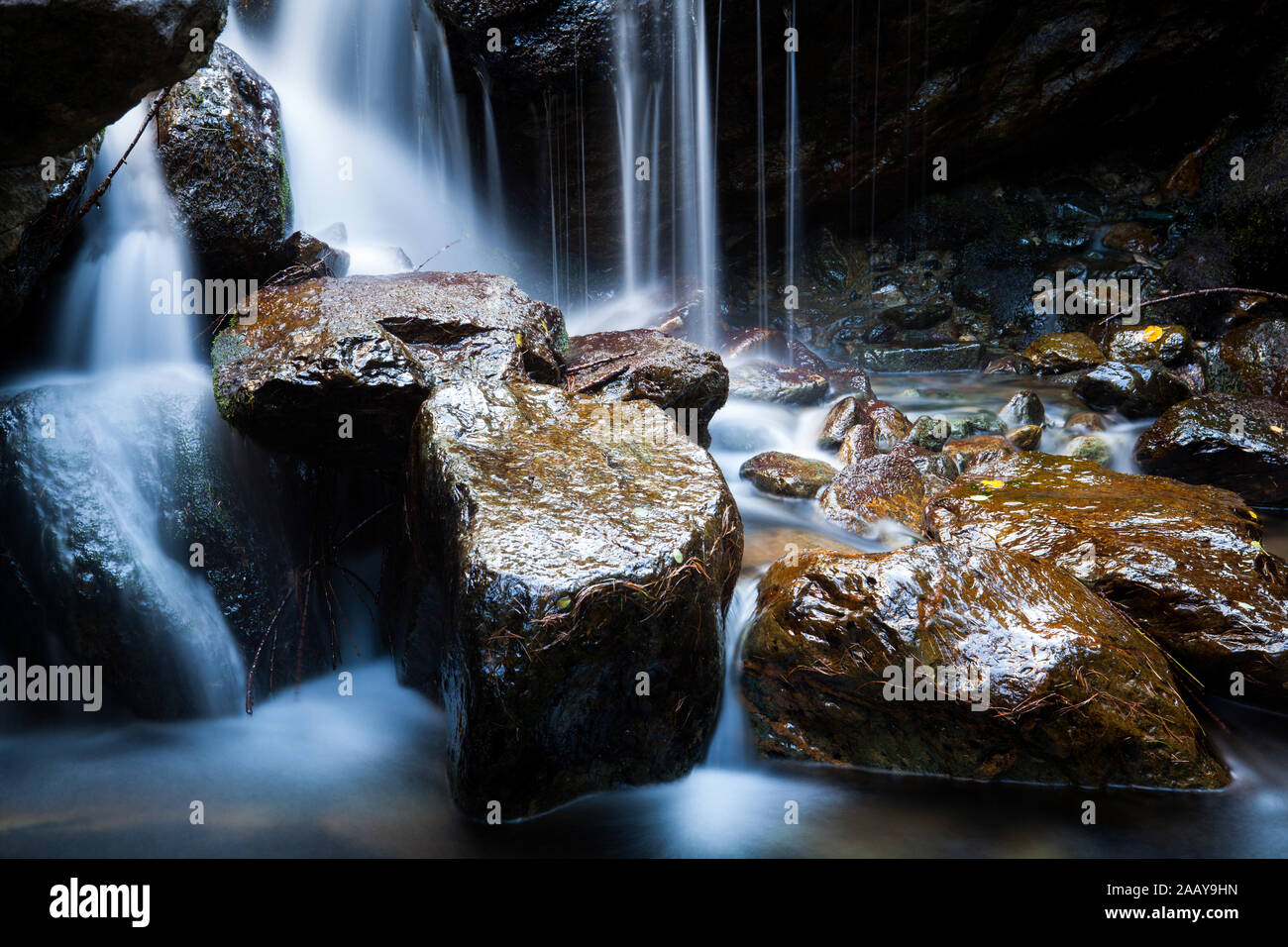 small waterfall in alpine stream Stock Photo - Alamy
