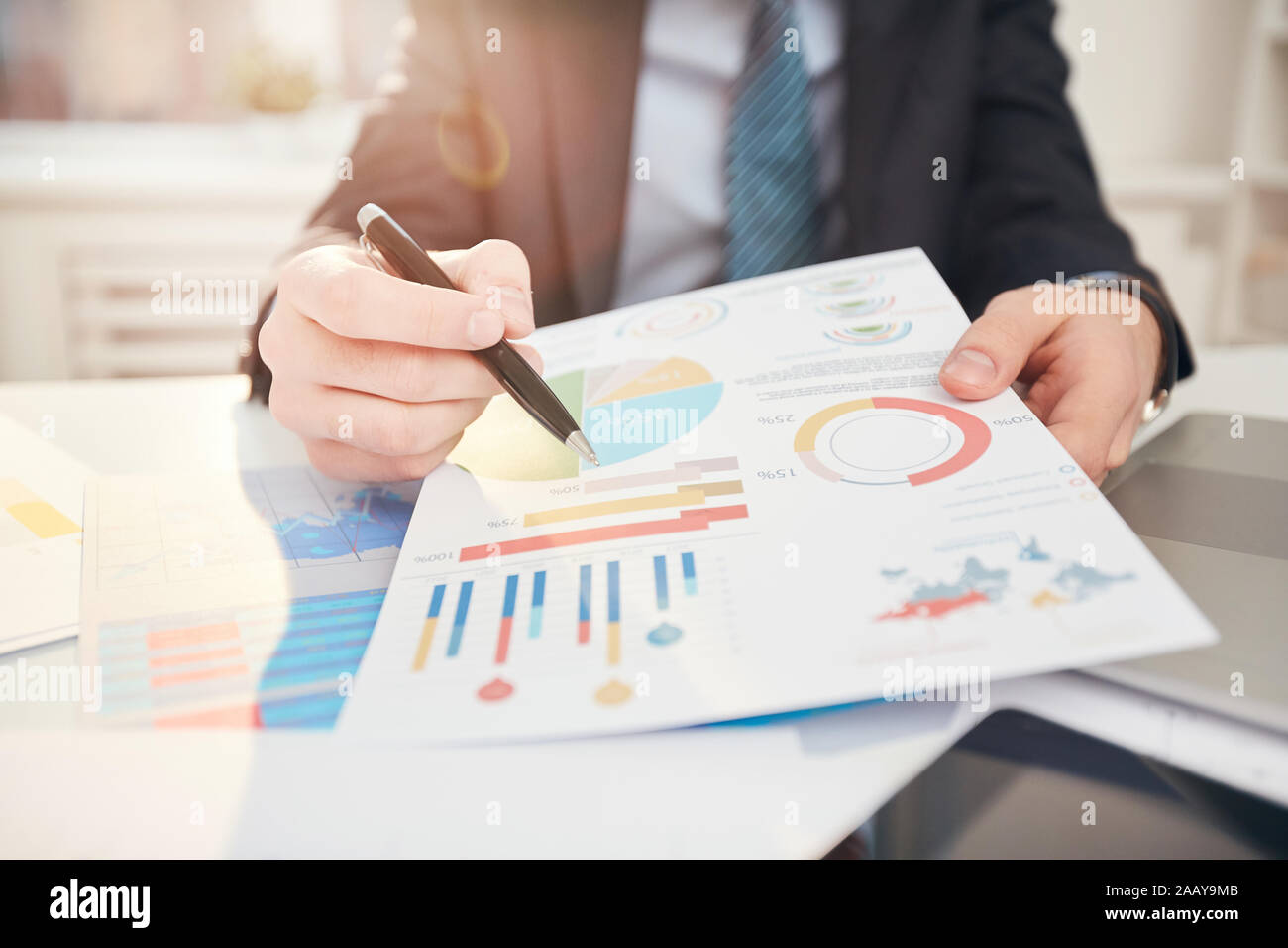 Fisheye view of unrecognizable businessman showing colorful data graph ...