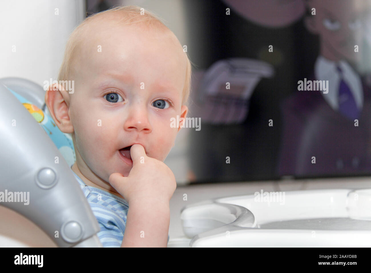 Photo of the One year Baby watching cartoons on TV and playing Stock ...