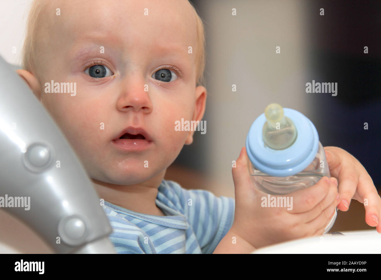 Photo of the One year Baby watching cartoons on TV and playing Stock ...