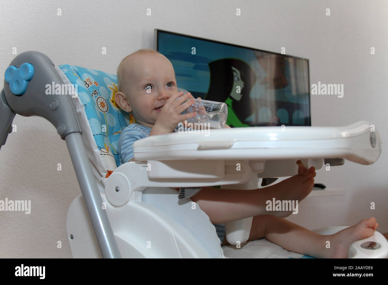 Photo of the One year Baby watching cartoons on TV and playing Stock ...