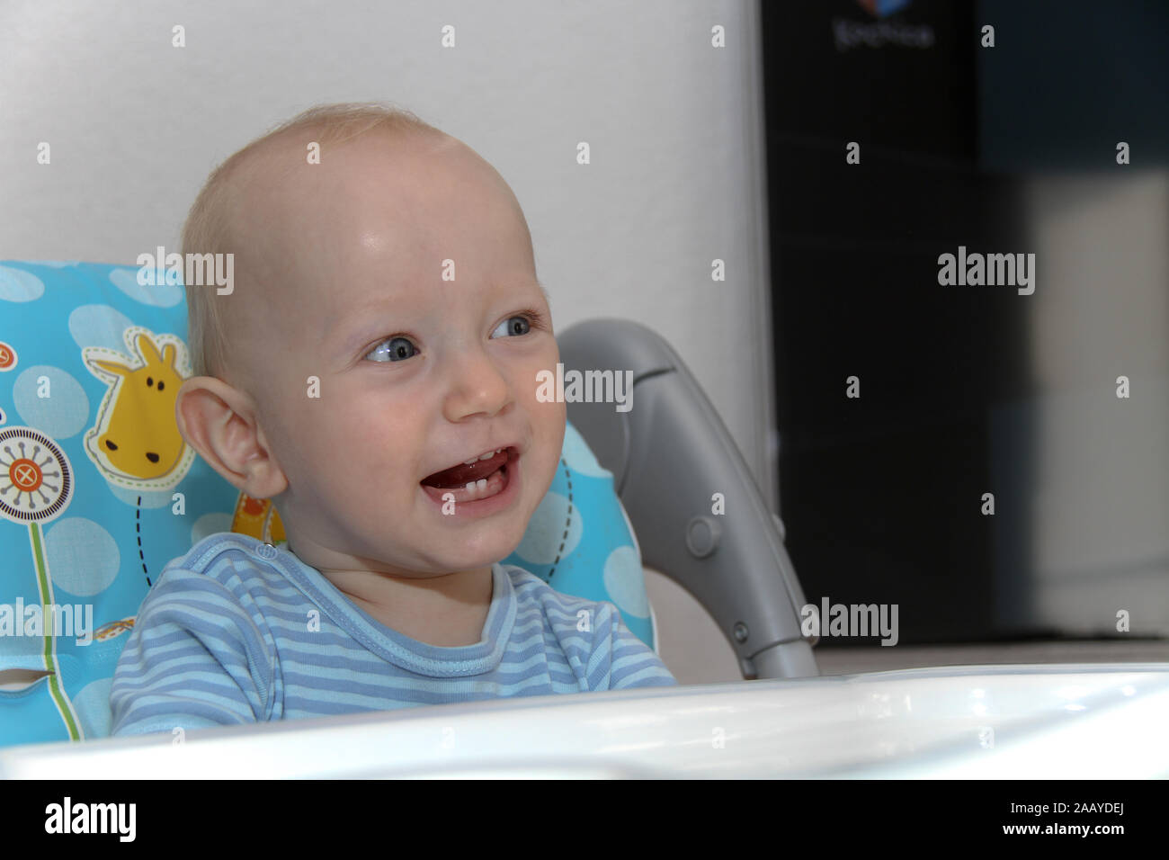 Photo of the One year Baby watching cartoons on TV and playing Stock ...