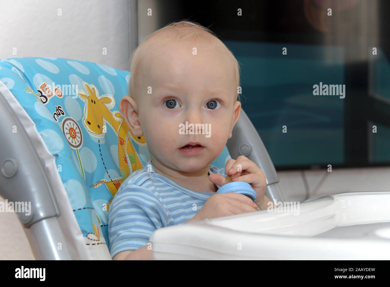 Photo of the One year Baby watching cartoons on TV and playing Stock ...