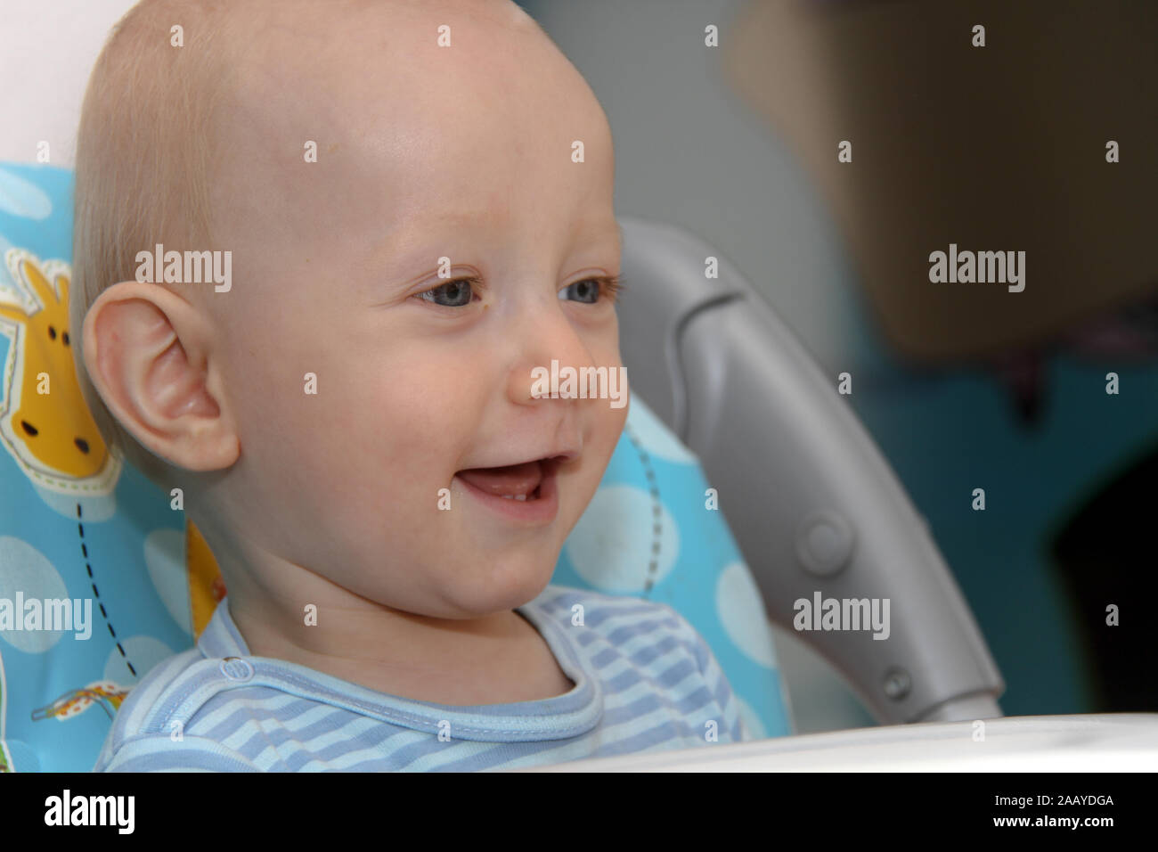 Photo of the One year Baby watching cartoons on TV and playing Stock ...