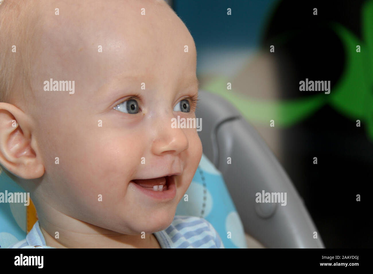 Photo of the One year Baby watching cartoons on TV and playing Stock ...