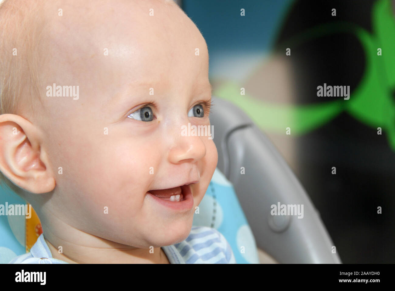 Photo of the One year Baby watching cartoons on TV and playing Stock ...