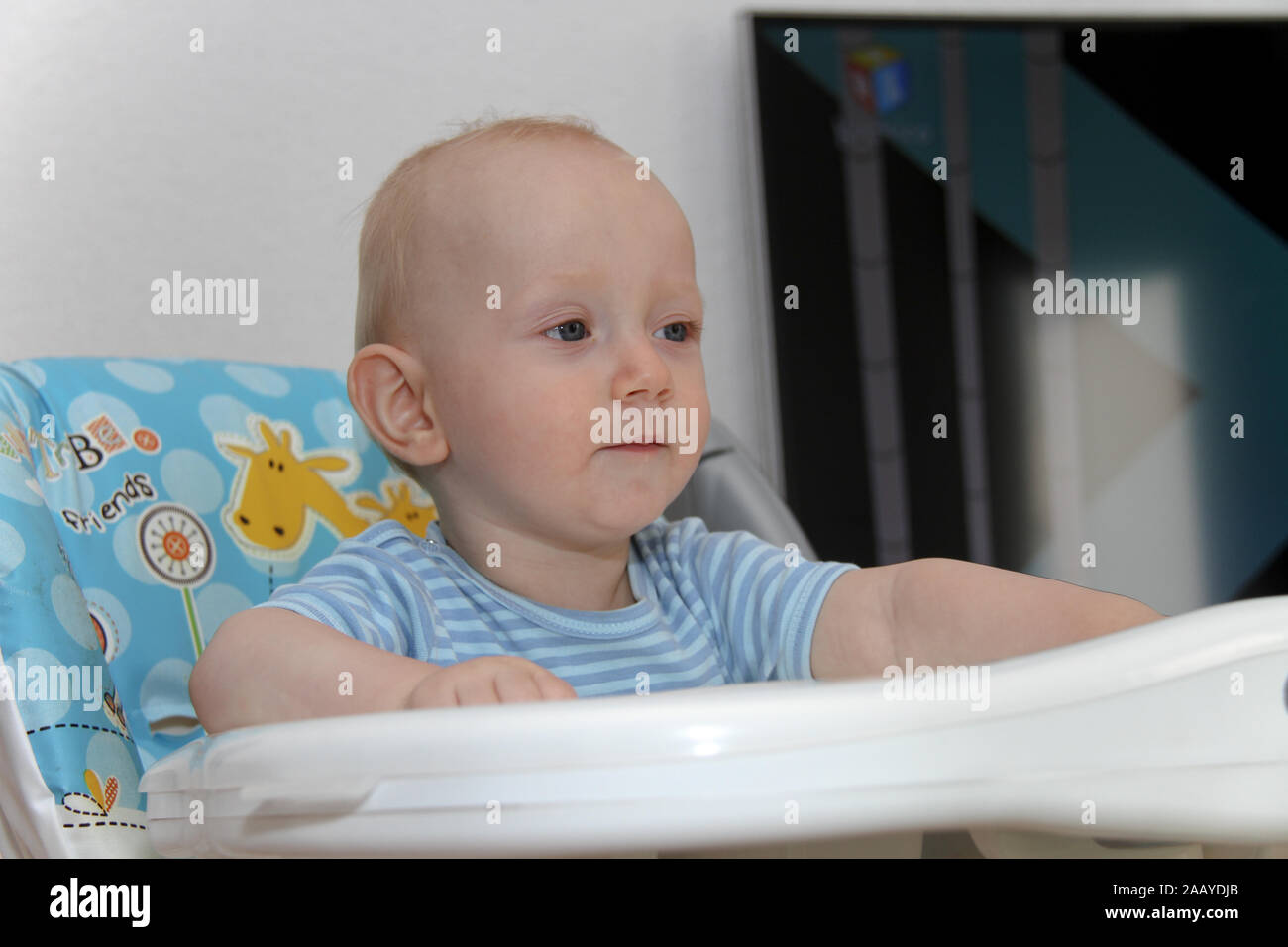 Photo of the One year Baby watching cartoons on TV and playing Stock ...