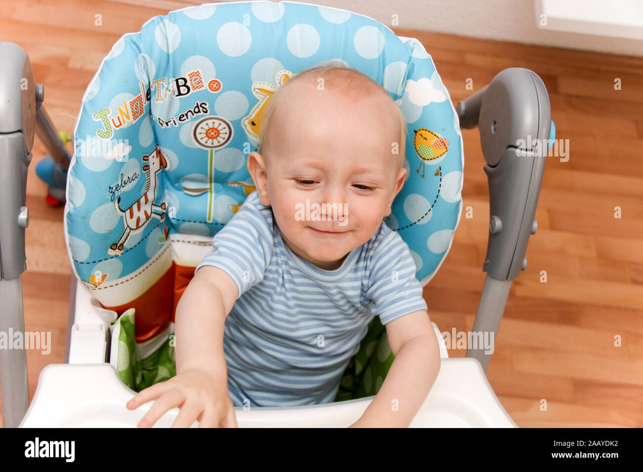 Photo of the One year Baby watching cartoons on TV and playing Stock ...