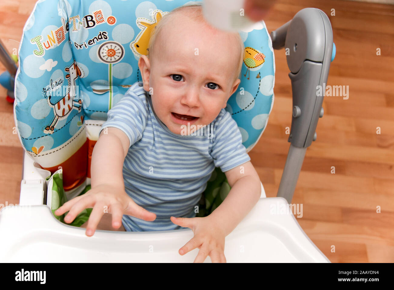 Photo of the One year Baby watching cartoons on TV and playing Stock ...