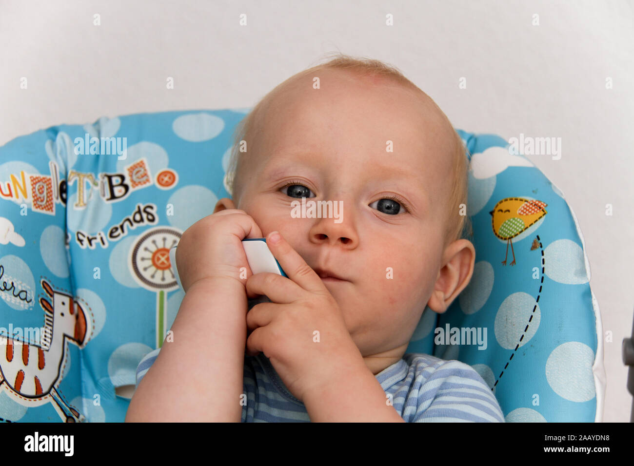 Photo of the One year Baby watching cartoons on TV and playing Stock ...