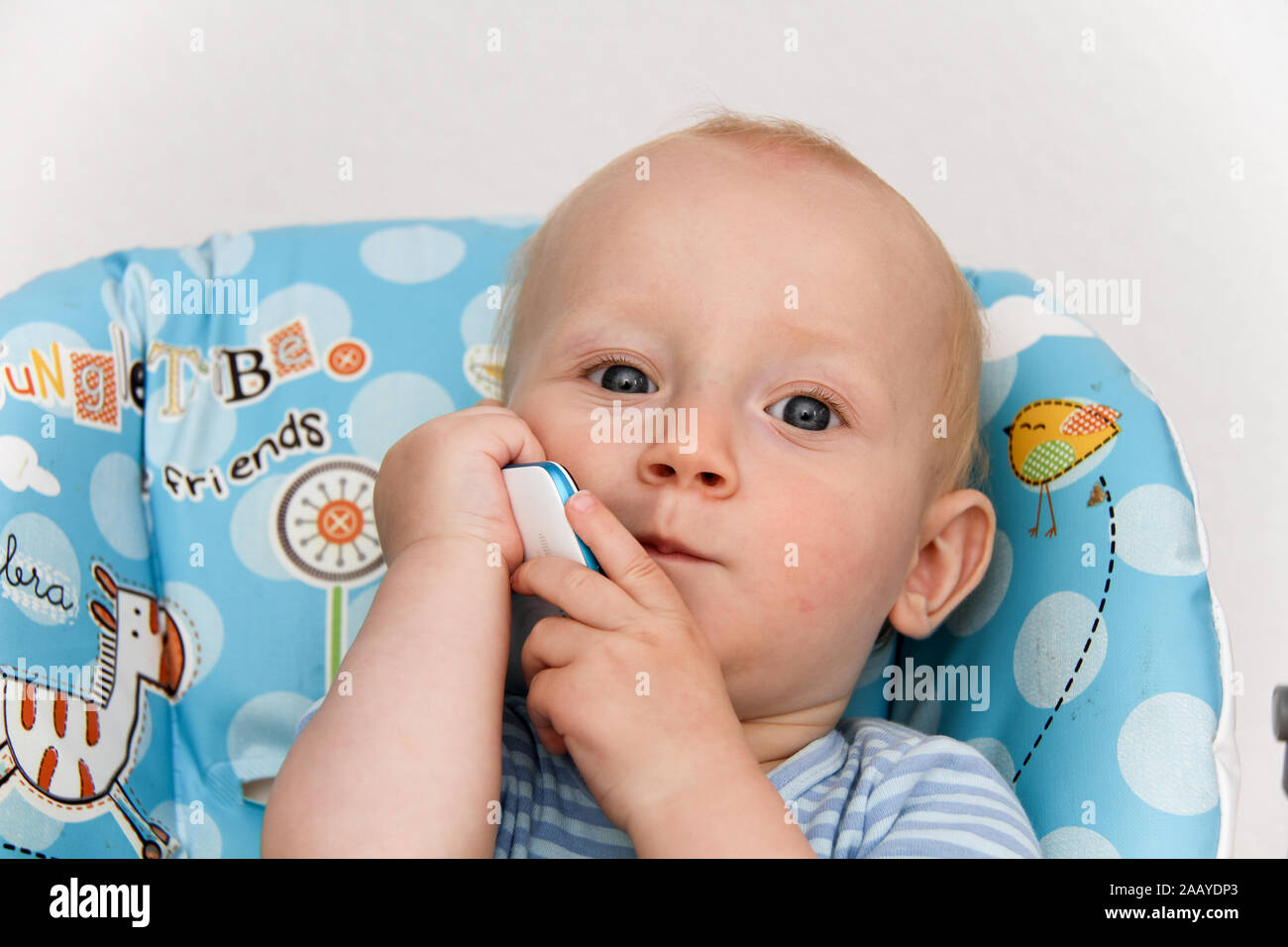 Photo of the One year Baby watching cartoons on TV and playing Stock ...