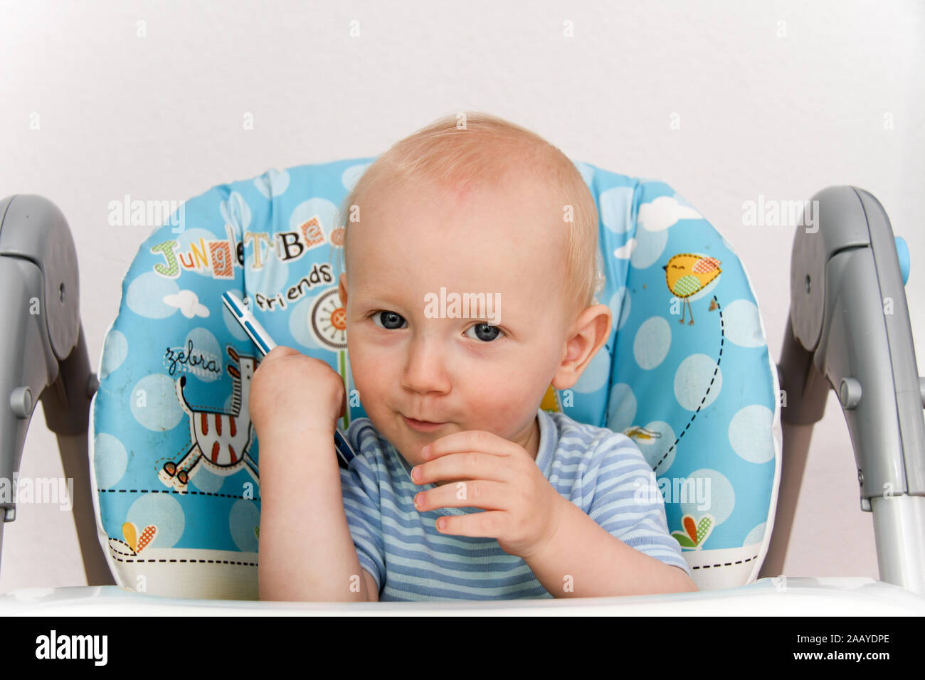 Photo of the One year Baby watching cartoons on TV and playing Stock ...