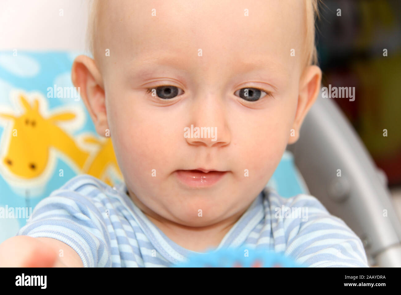 Photo of the One year Baby watching cartoons on TV and playing Stock ...