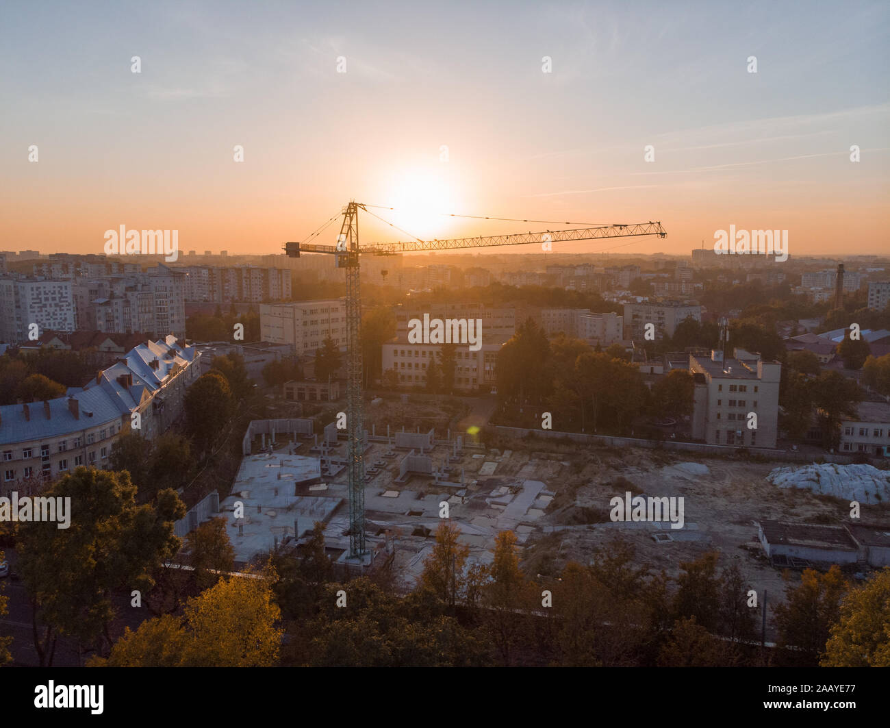 construction building site crane on sunset Stock Photo - Alamy