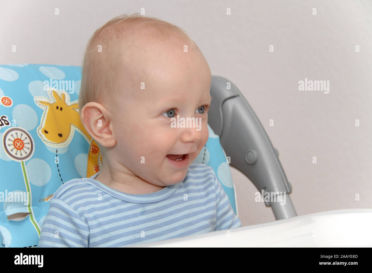 Photo of the One year Baby watching cartoons on TV and playing Stock ...