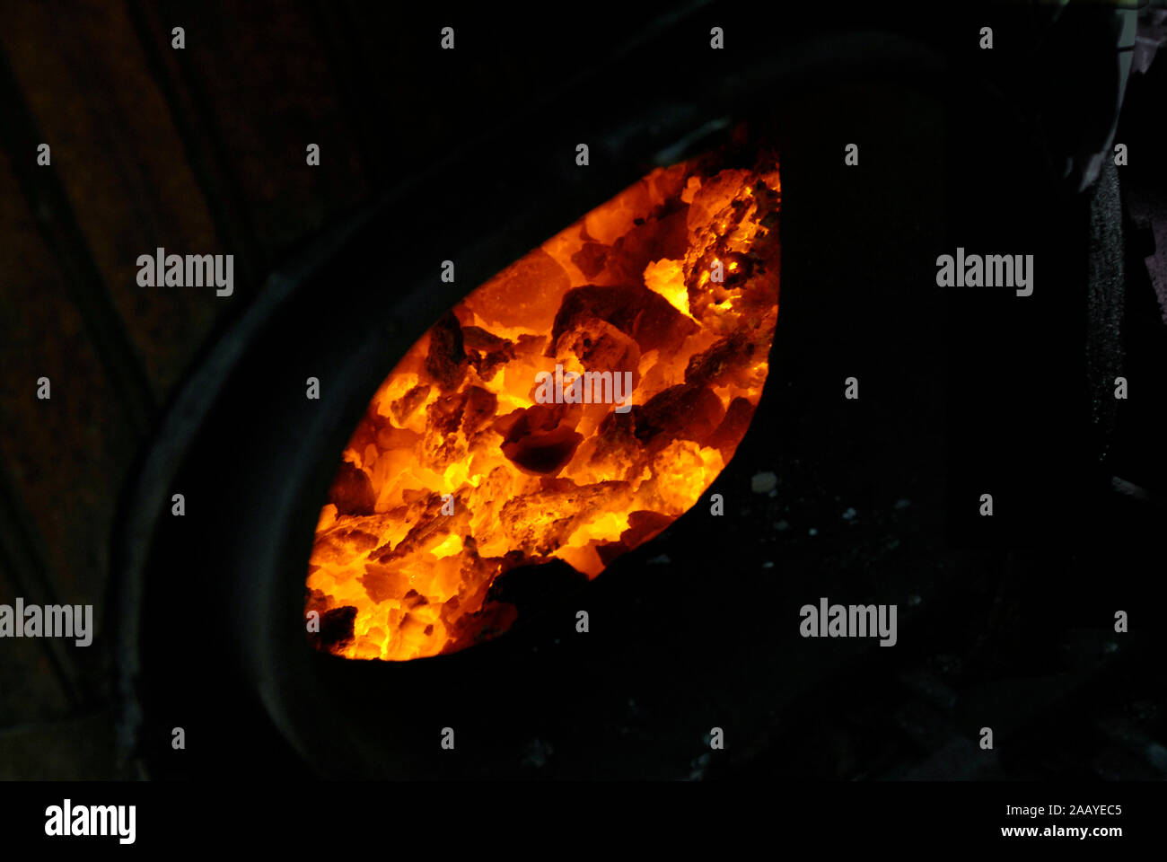 Fire in the furnace of a coal-fired, steam-powered small passenger ...