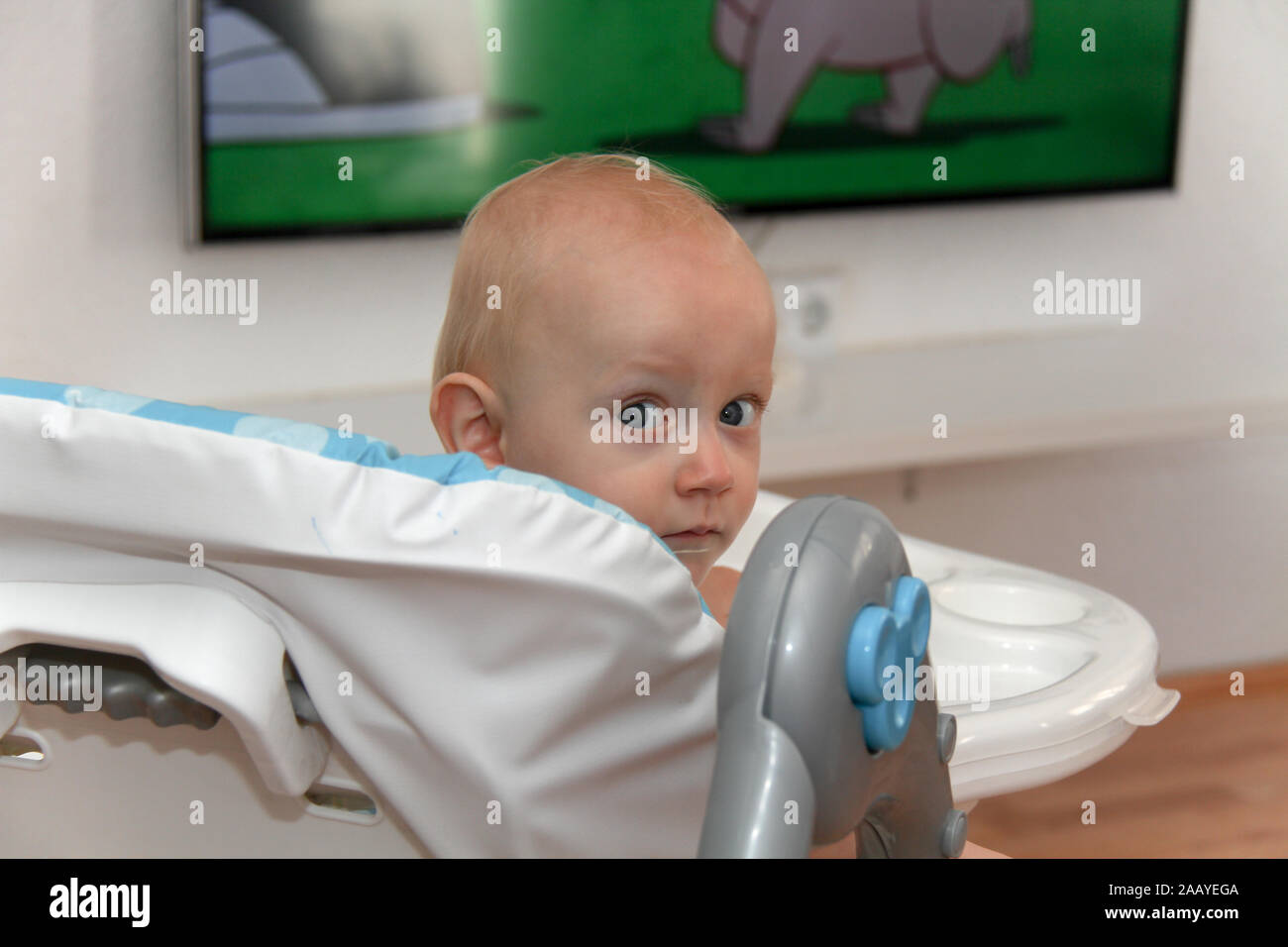 Photo of the One year Baby watching cartoons on TV and playing Stock ...