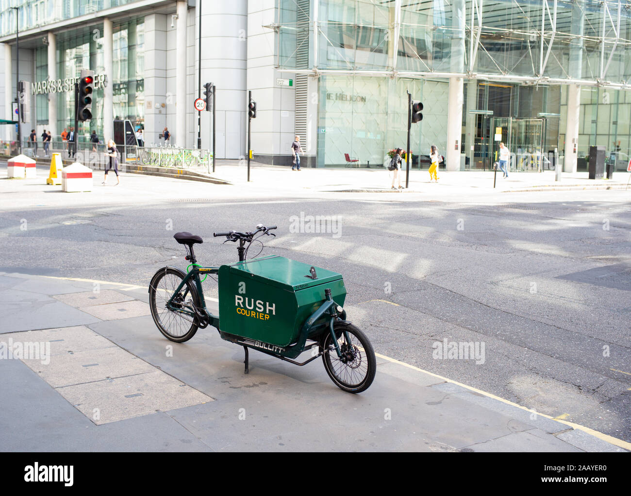 A Rush delivery courier cycle carrier sits alone on a London street ...