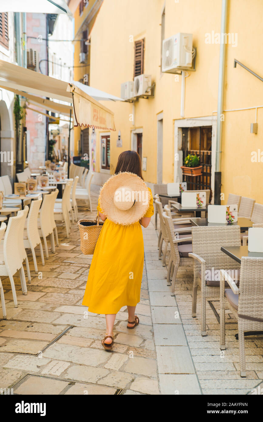 Woman walking between restaurant tables hi-res stock photography and ...