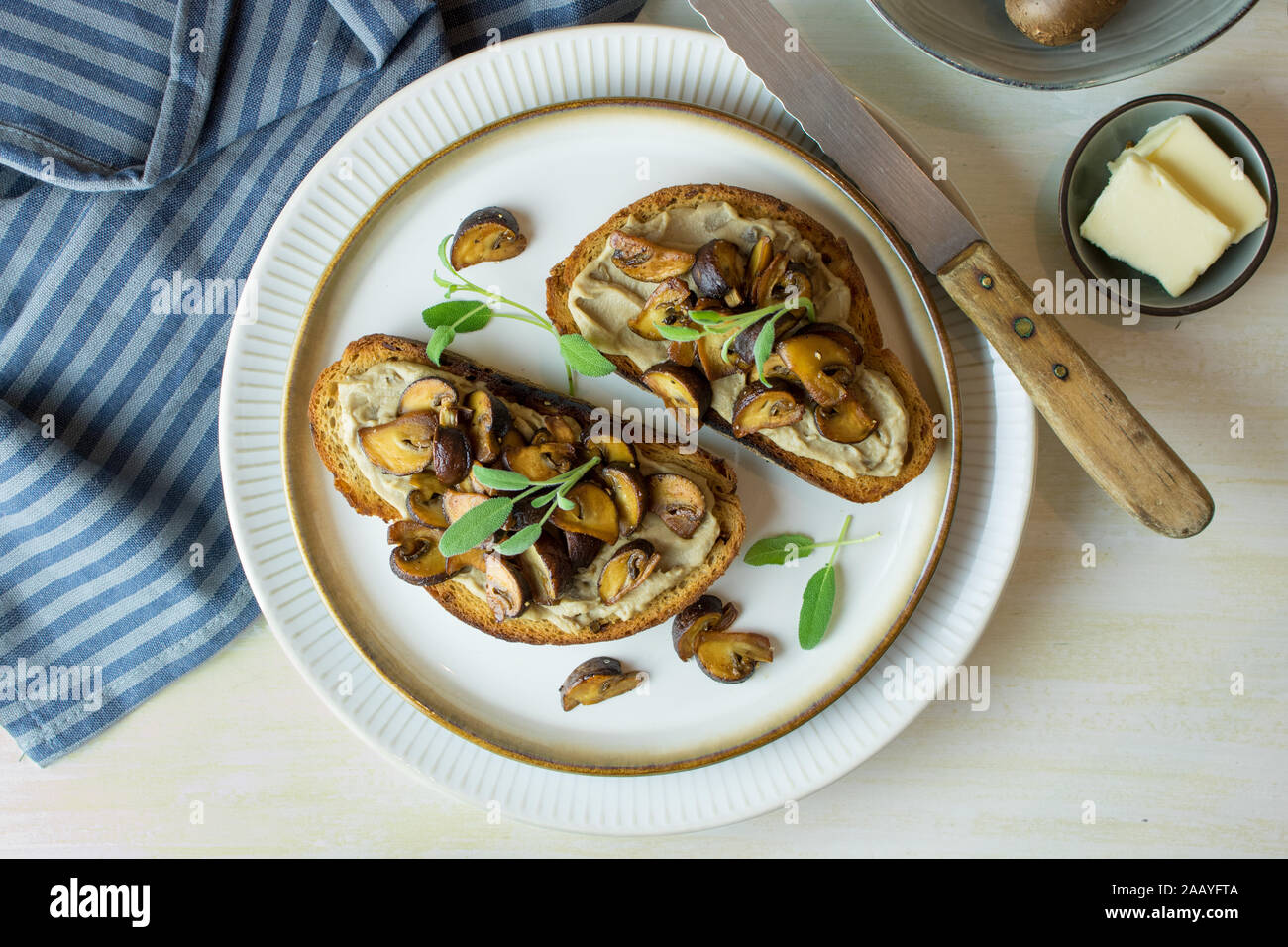 Food photography of toasted ciabatta bread crostini with mushroom paté ...