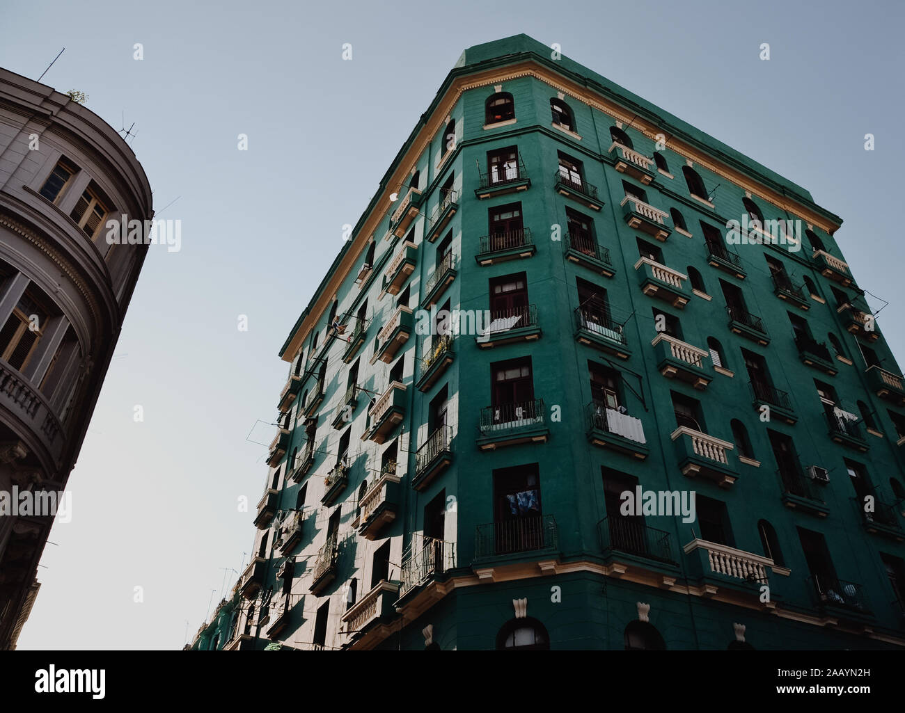 Facade of a restored building painted turquoise Stock Photo - Alamy