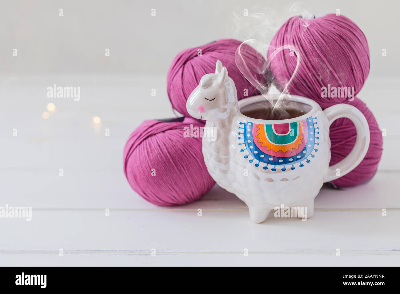 Colorful Llama shaped tea or coffee mug with wool yarn, toned Stock ...