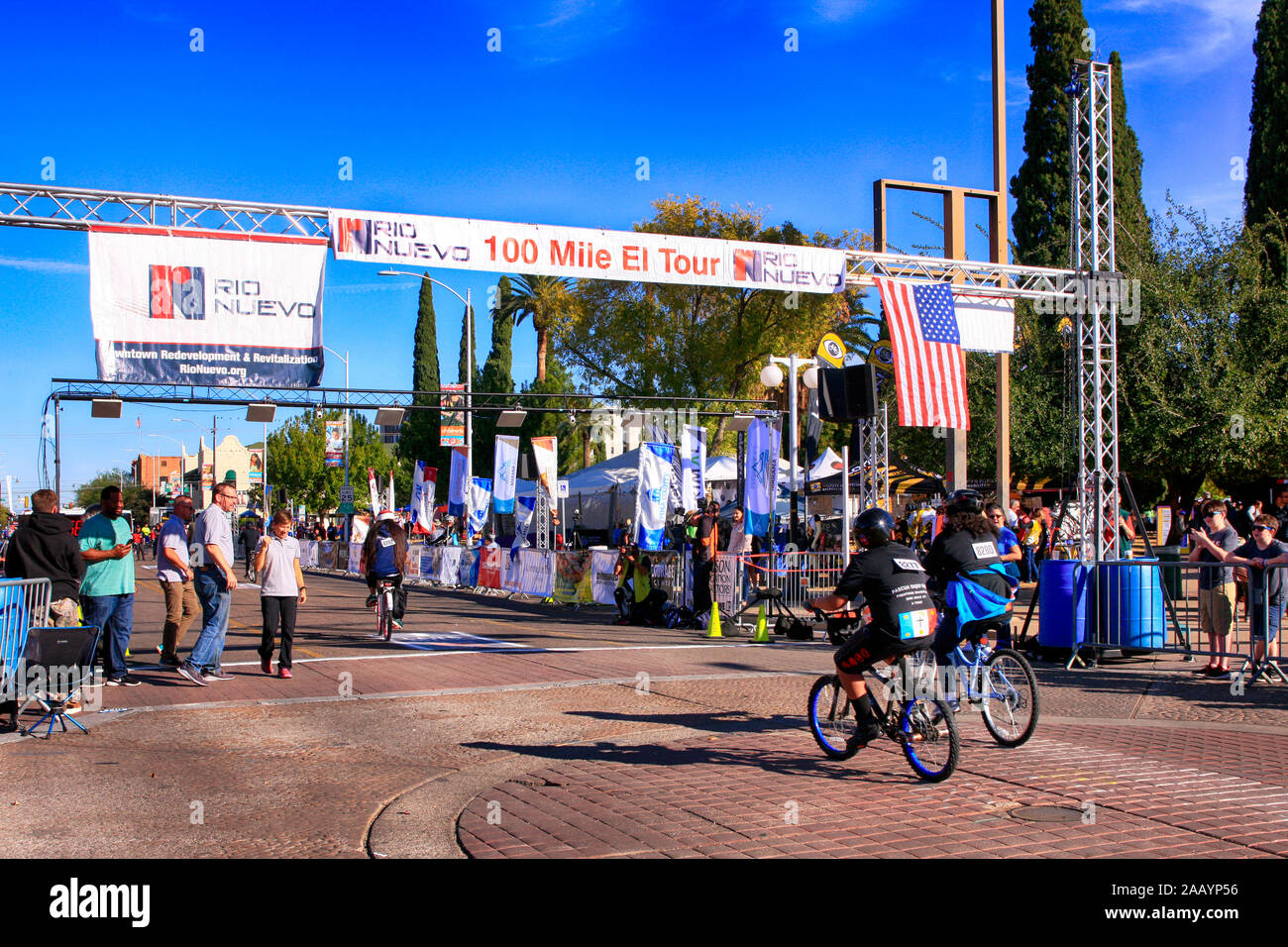People in the fun race pass over the finish line for the 100 mile el ...