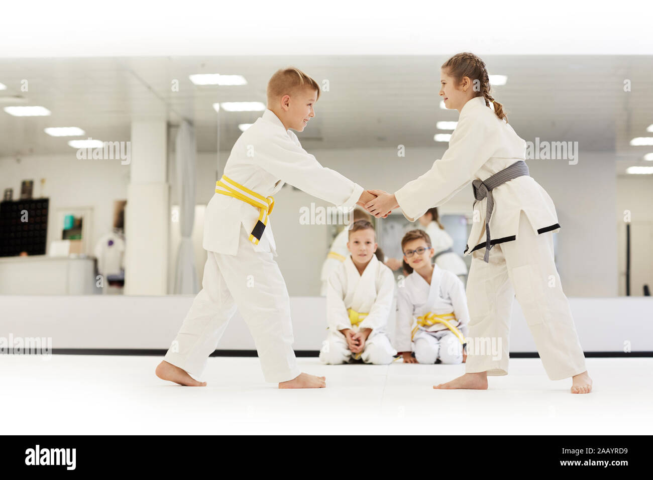 Boy and girl standing opposite the each other and fighting with other ...