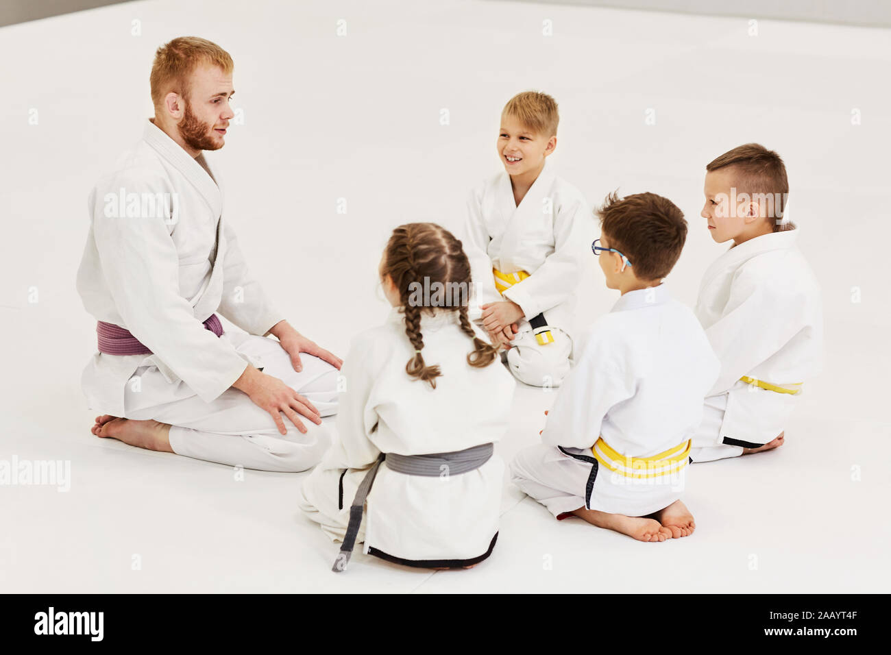 Karate student listening instructor hi-res stock photography and images ...