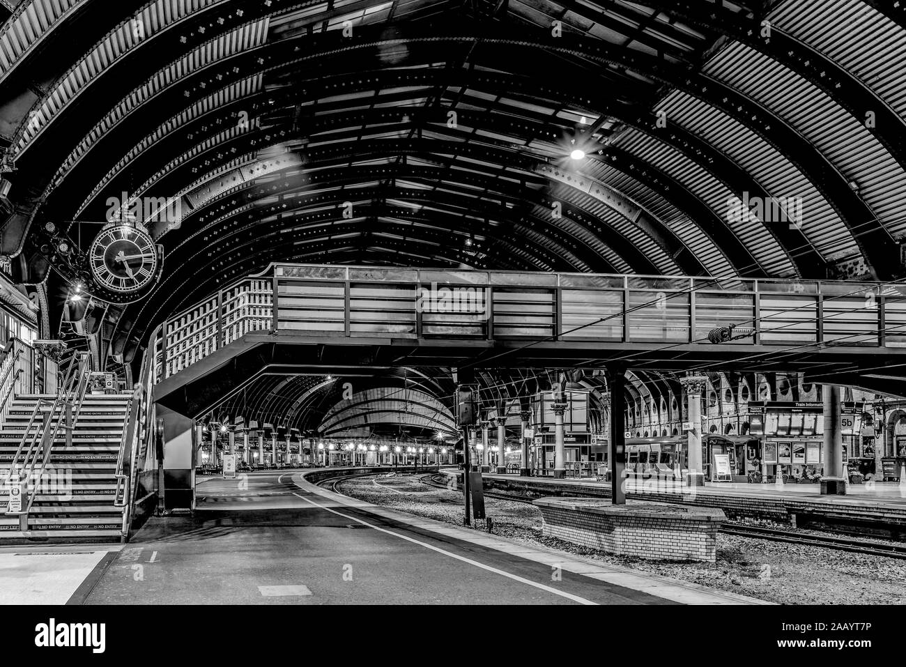 York Railway Station at night. Steps lead up to a footbridge while ...