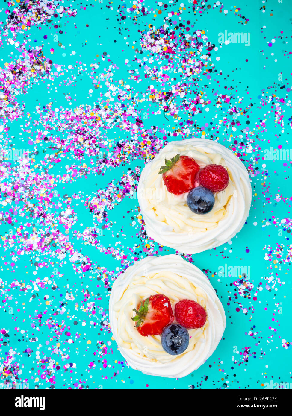 Meringue Pavlova with cream and fresh berries, strawberries ...