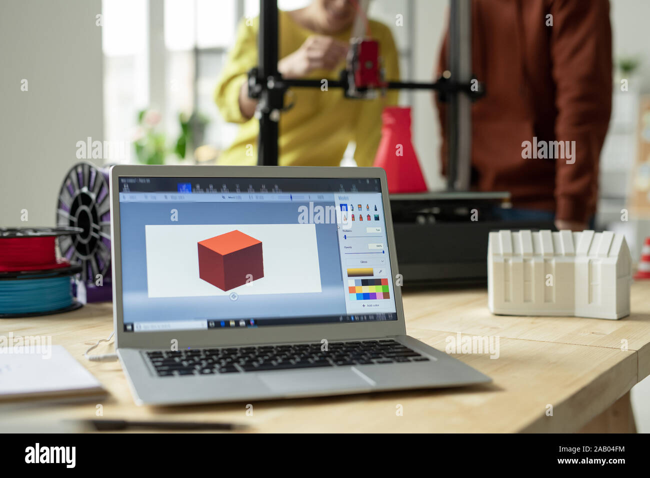 Workplace of creative engineer or designer with laptop and picture of ...