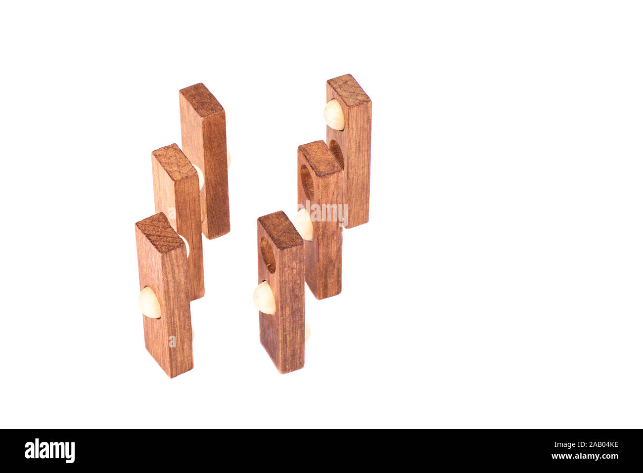 Puzzle details balls and holes. Wooden puzzle isolated on a white ...