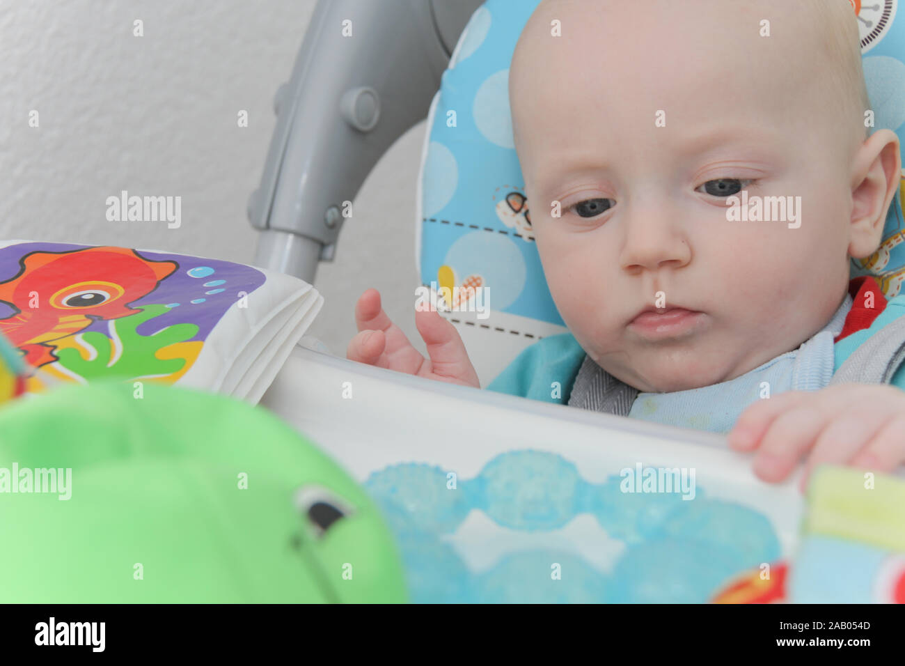 Photo of the Cute little baby boy is playing with toys Stock Photo - Alamy