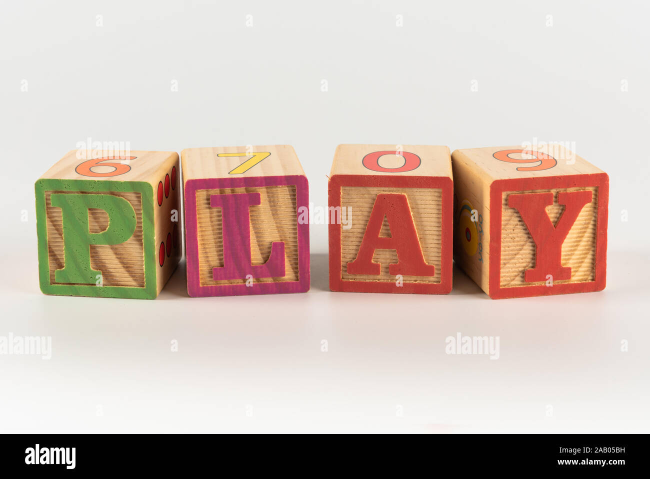 A child's alphabet toy spelling word block set, spelling out the word ...