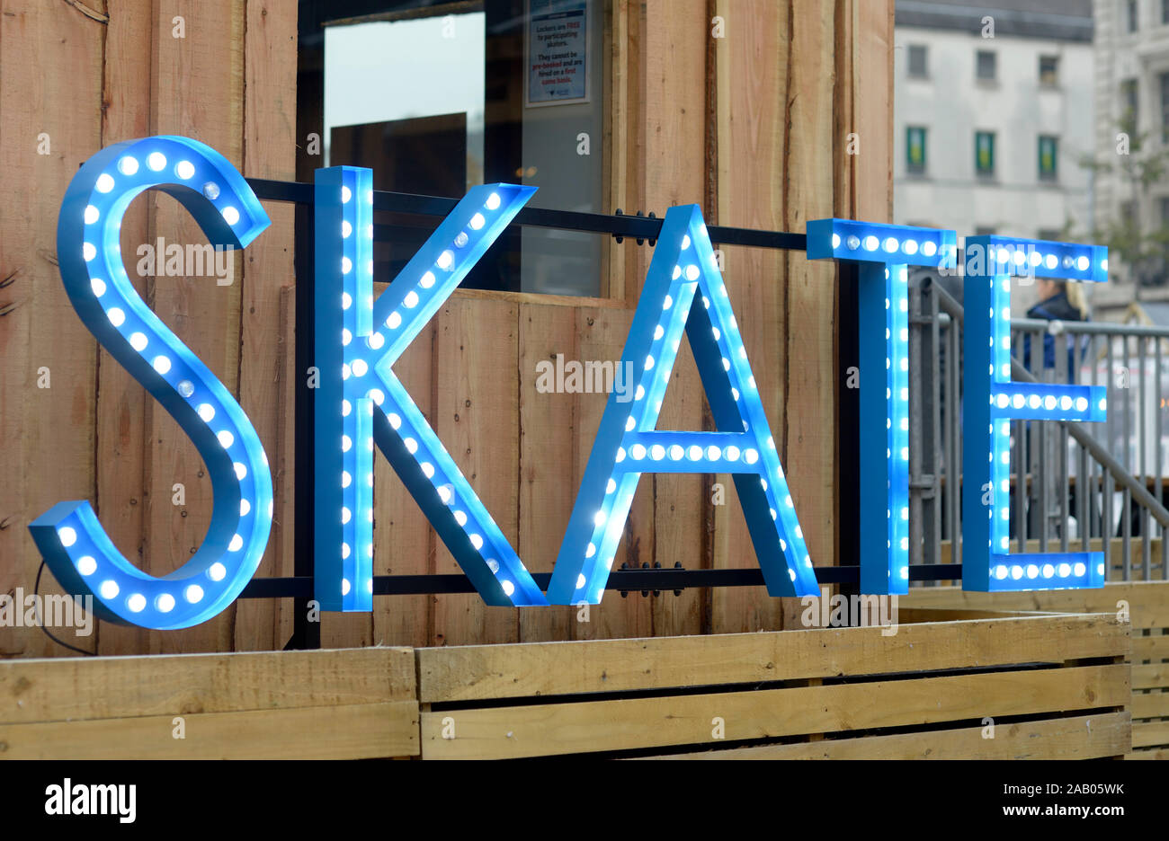 Illuminated SKATE sign, for the ice rink Stock Photo - Alamy