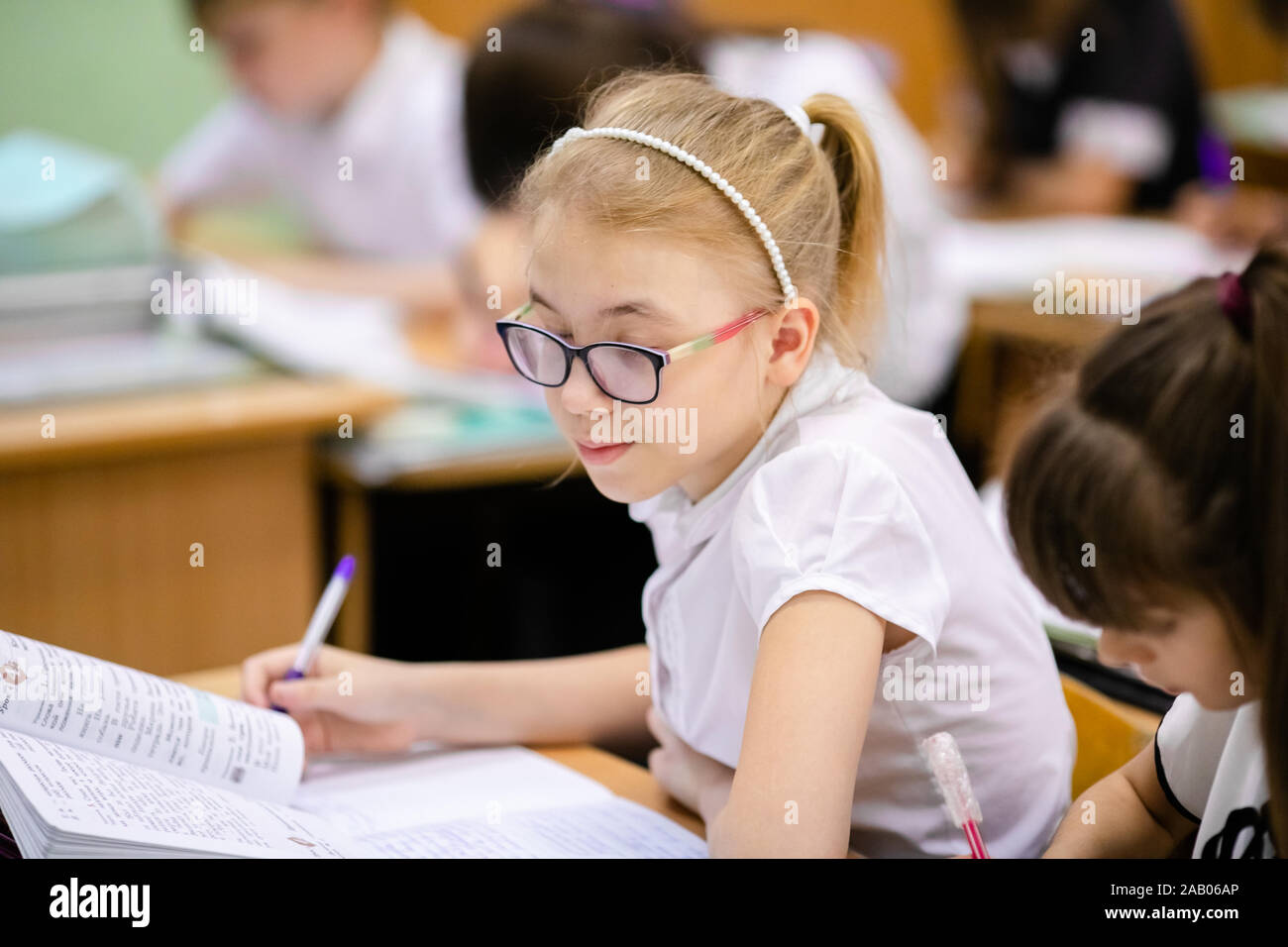 Student doing classwork hi-res stock photography and images - Alamy