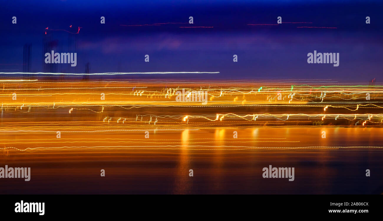 Abstract Light trails on dark background, motion blured Stock Photo - Alamy