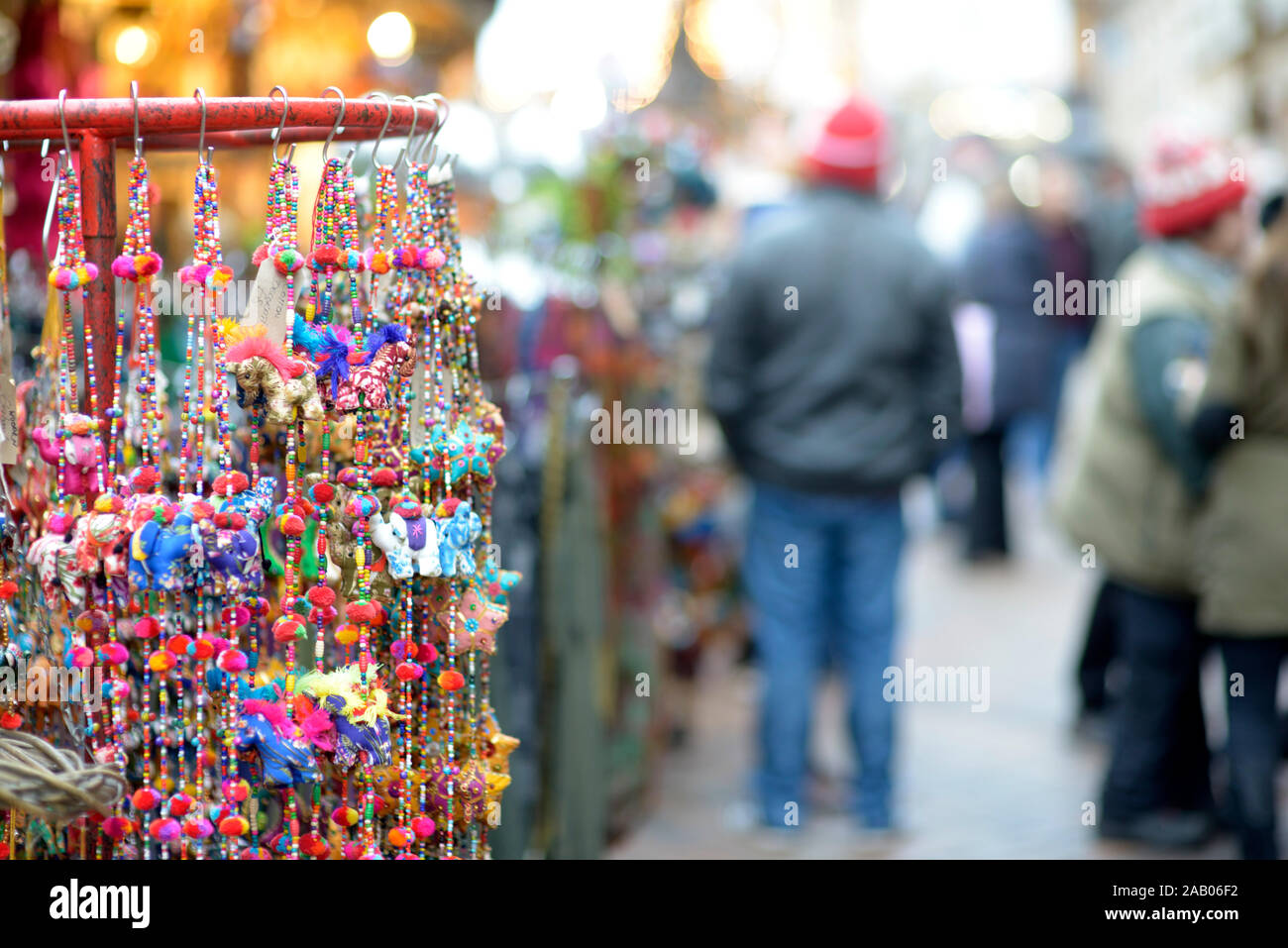 Strings of colourful decorations on stall Stock Photo - Alamy