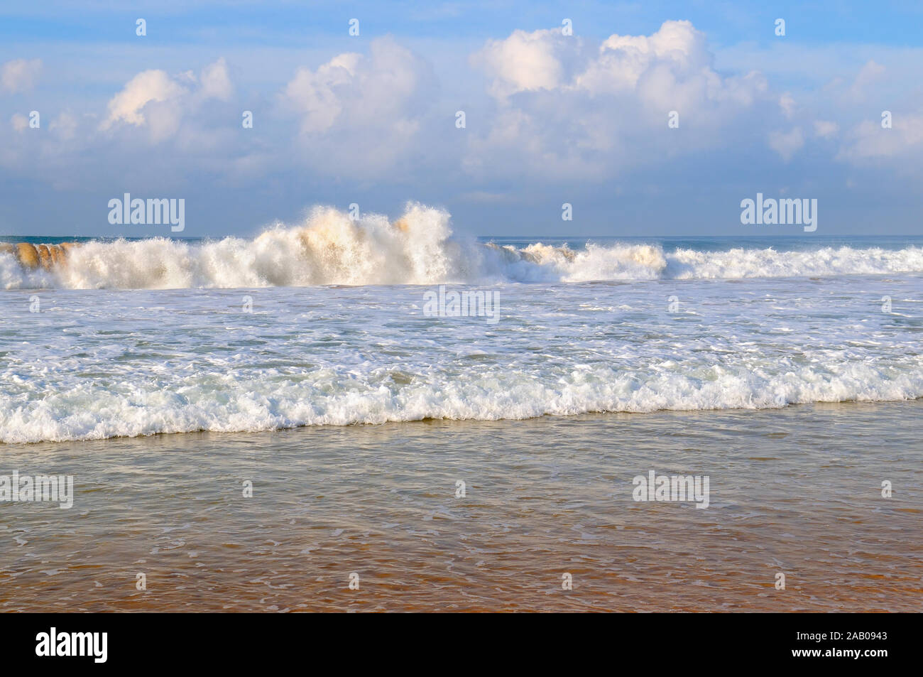 ocean, sandy beach and blue sky Stock Photo - Alamy