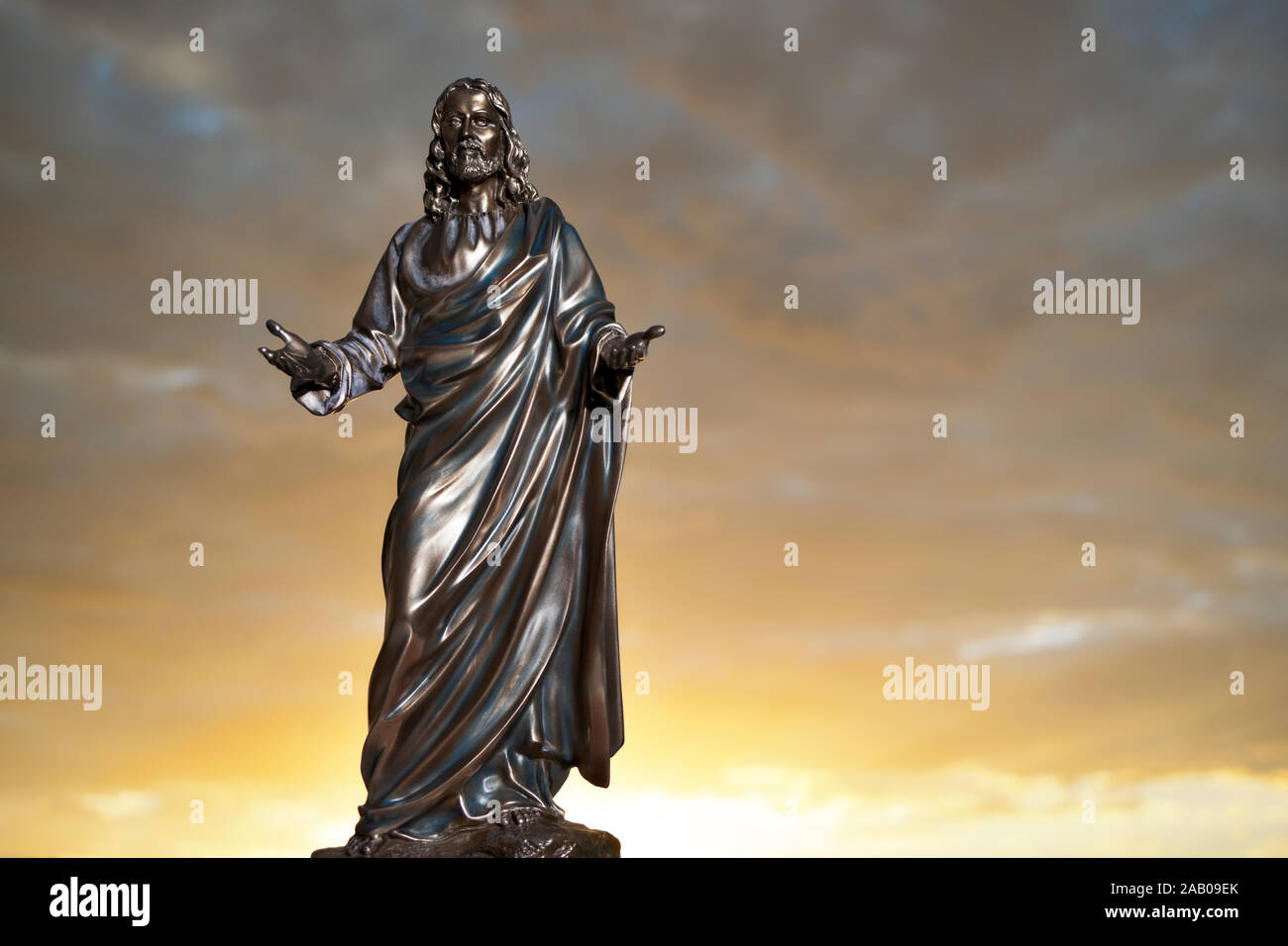 A small statue of a beckoning Jesus Christ Stock Photo - Alamy