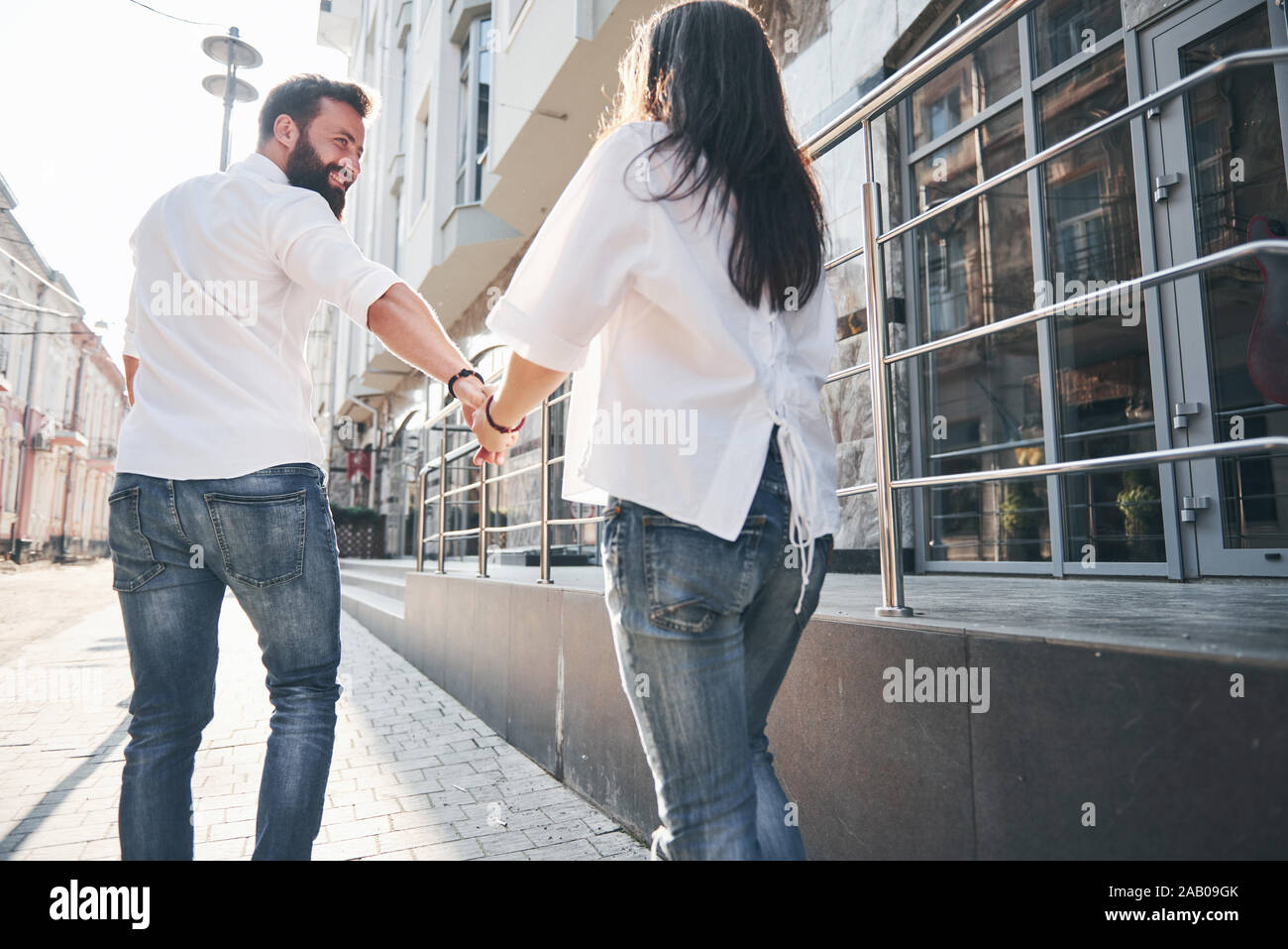 A young funny loving couple have fun on a sunny day Stock Photo - Alamy