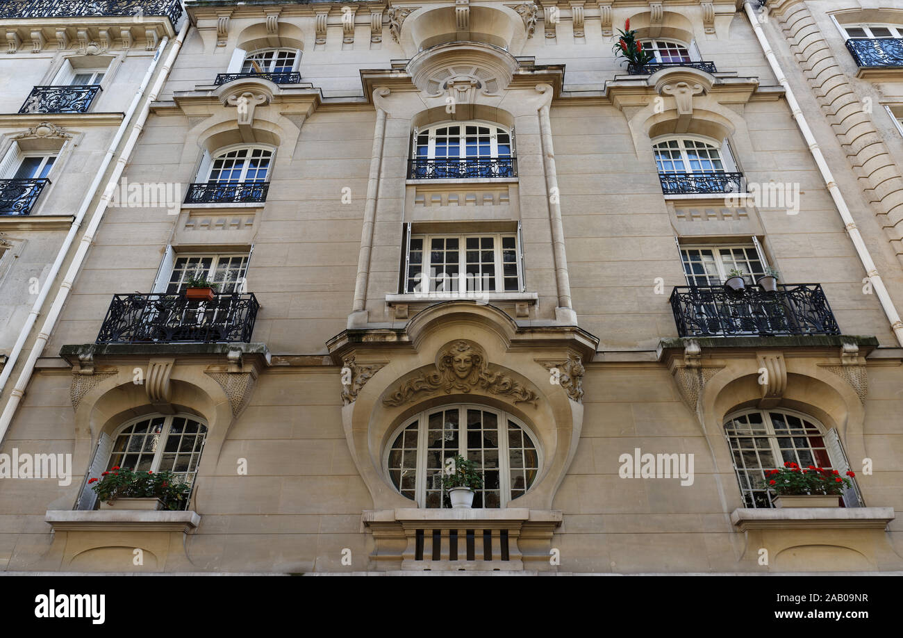 Traditional French house with typical balconies and windows. Paris ...